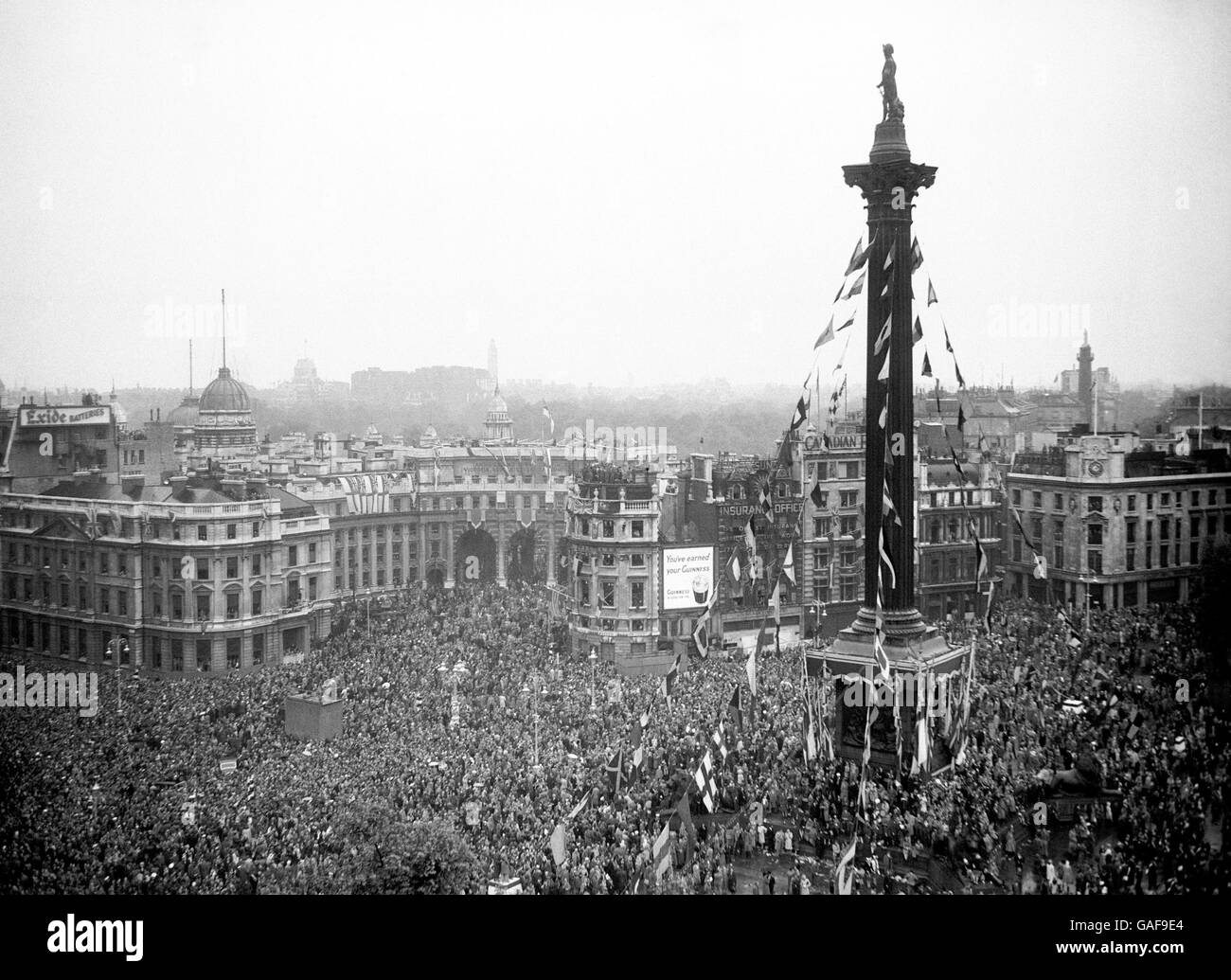 Huge crowds around Nelson's Column watch the fly-over after the Victory ...