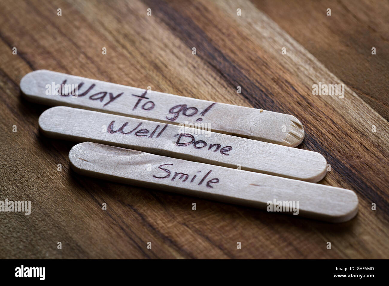 close up of a hand written message on a popsicle stick as a self esteem ...