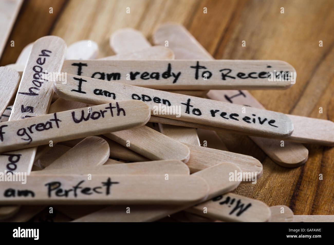 close up of a hand written message on a popsicle stick as a self esteem ...