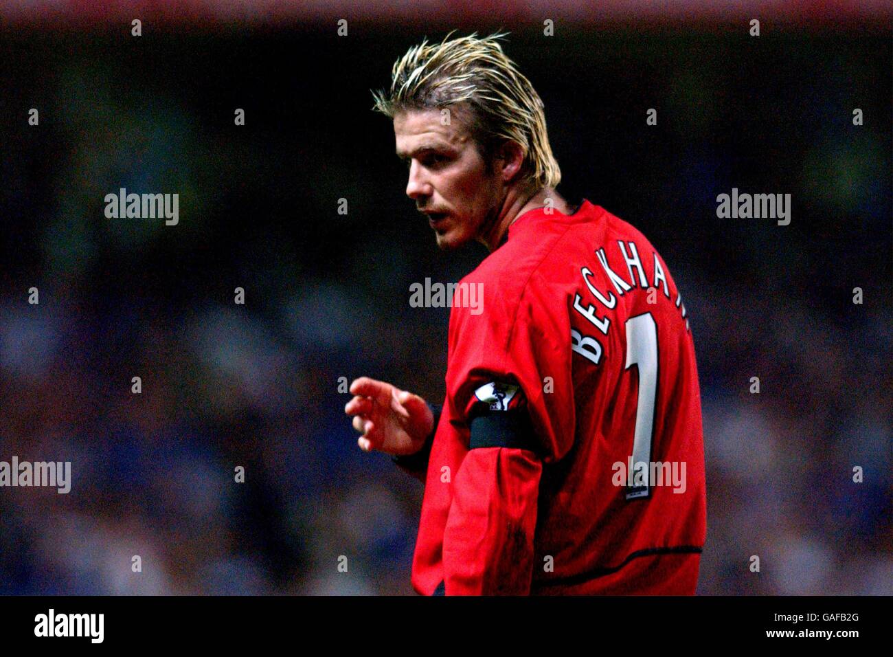 Manchester United's David Beckham wears a black arm band out as a mark ...