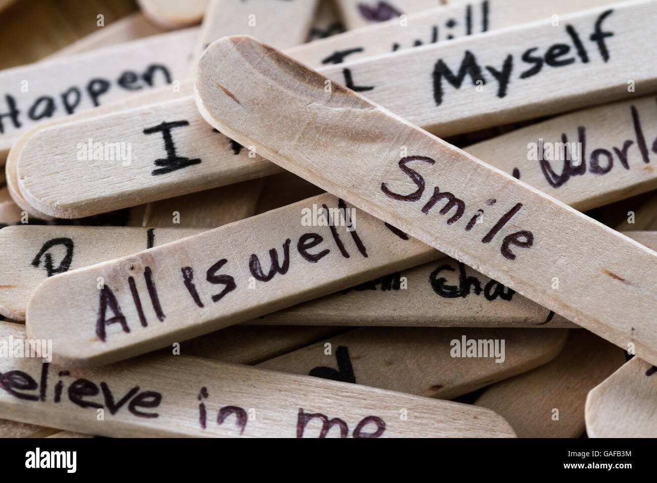 close up of a hand written message on a popsicle stick as a self esteem ...