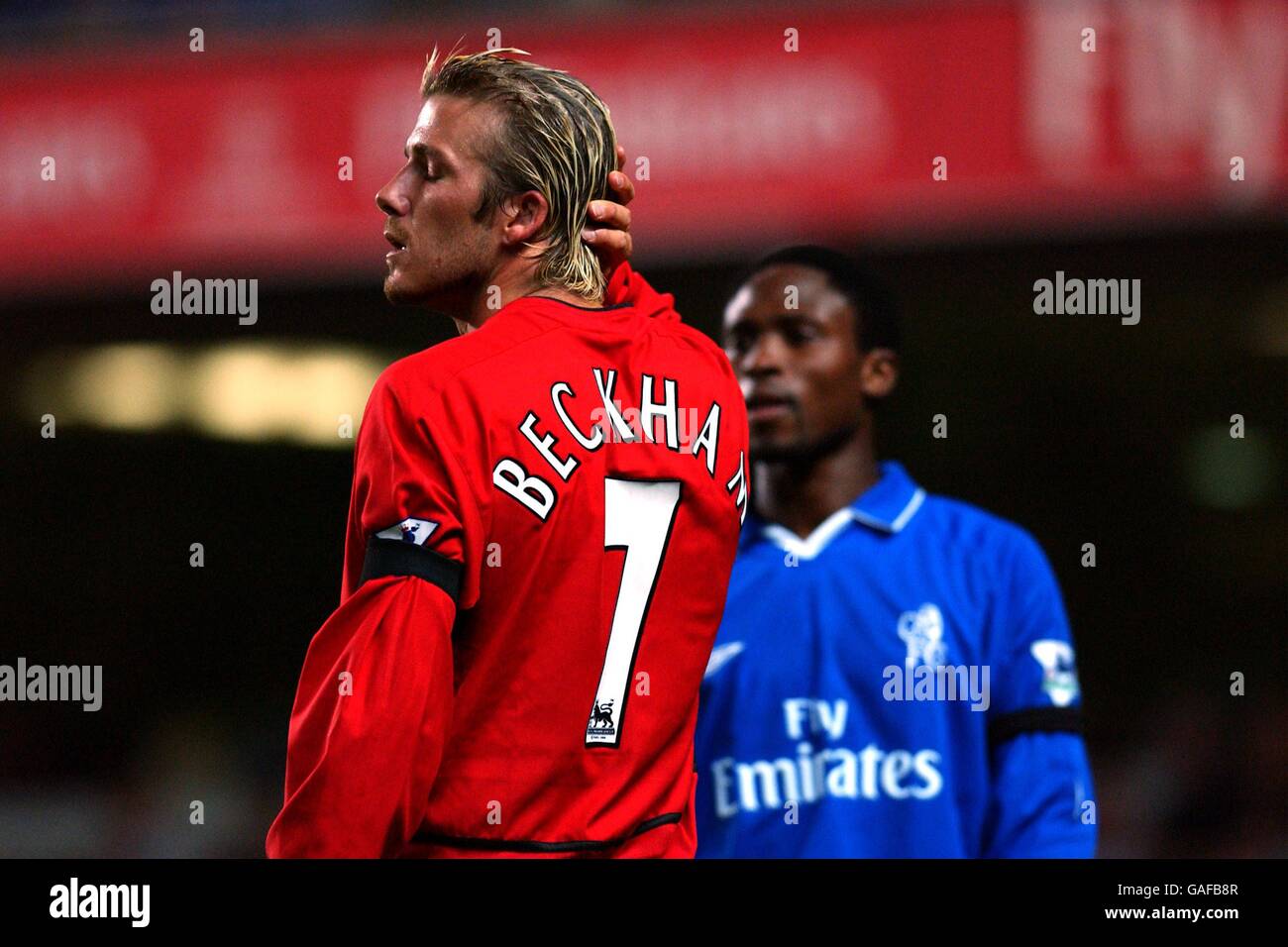 Manchester United's David Beckham wears a black arm band out as a mark ...