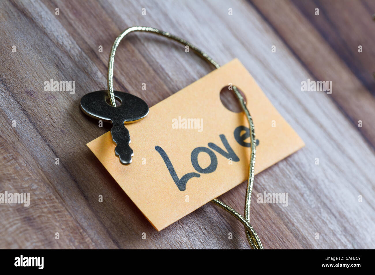 concept for a happy loving life using an old decorative key and a hand ...