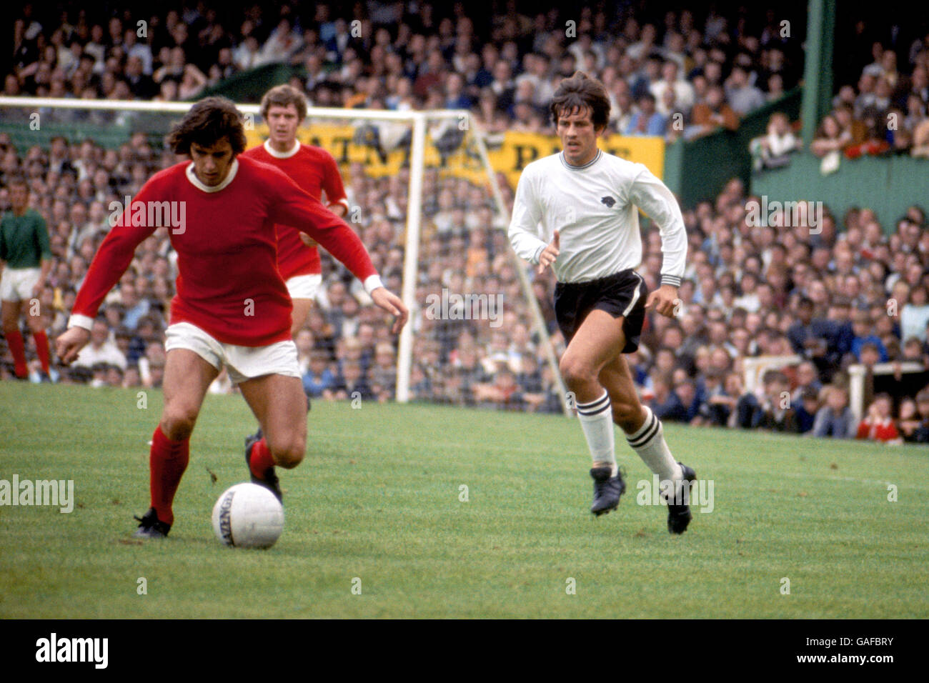 (L-R) Manchester United's Willie Morgan is pursued by Derby County's ...
