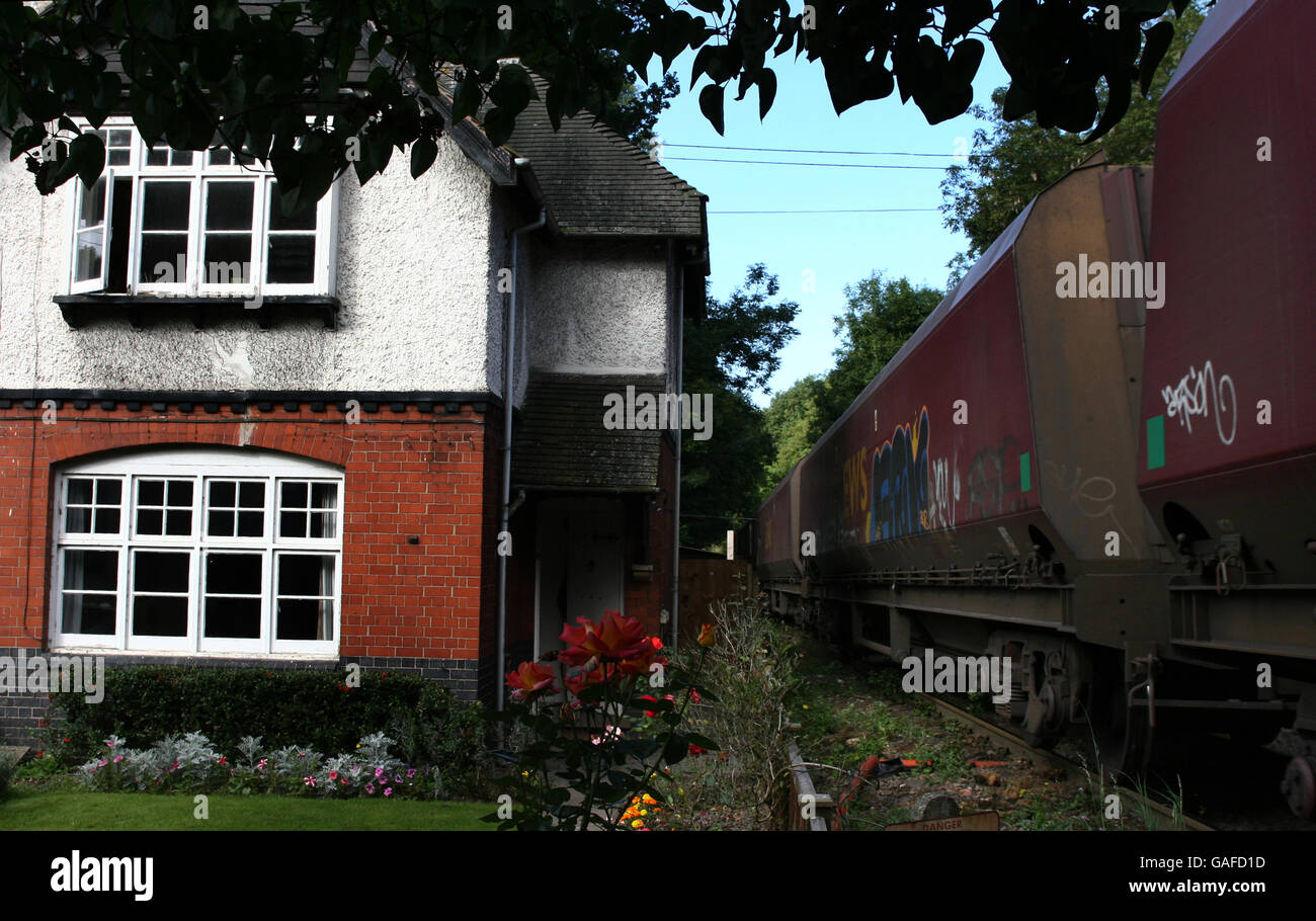 Freight Train operated by EWS goes past an Ironbridge house next to the ...