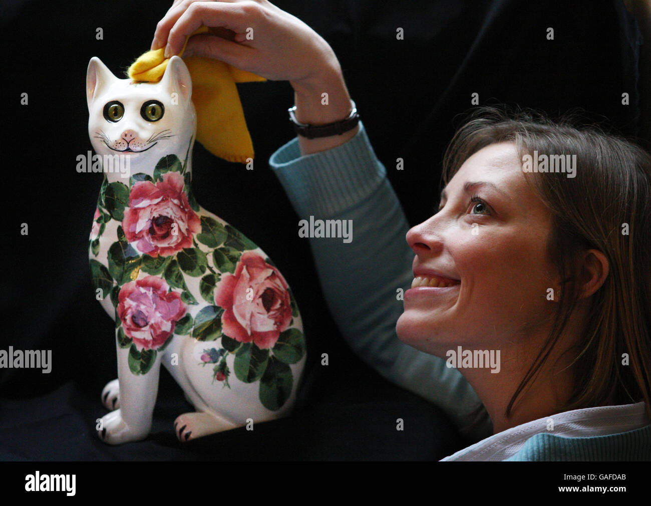Lyon and Turnbull auctioneers staff member Moira Goww with a Wemyss cat ...