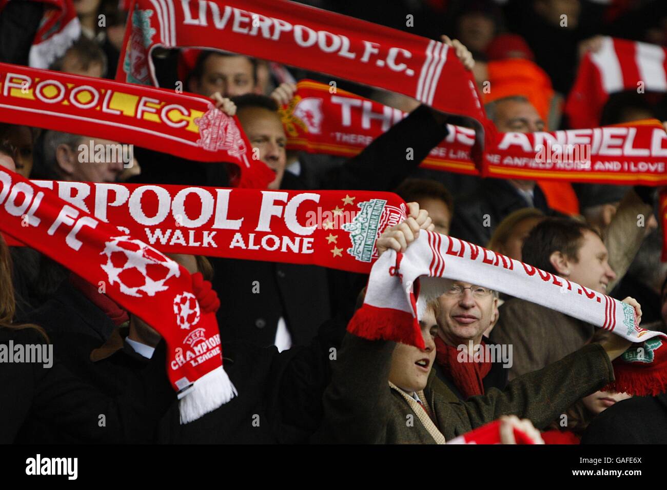 Liverpool fans in stands wave scarfs hi-res stock photography and ...