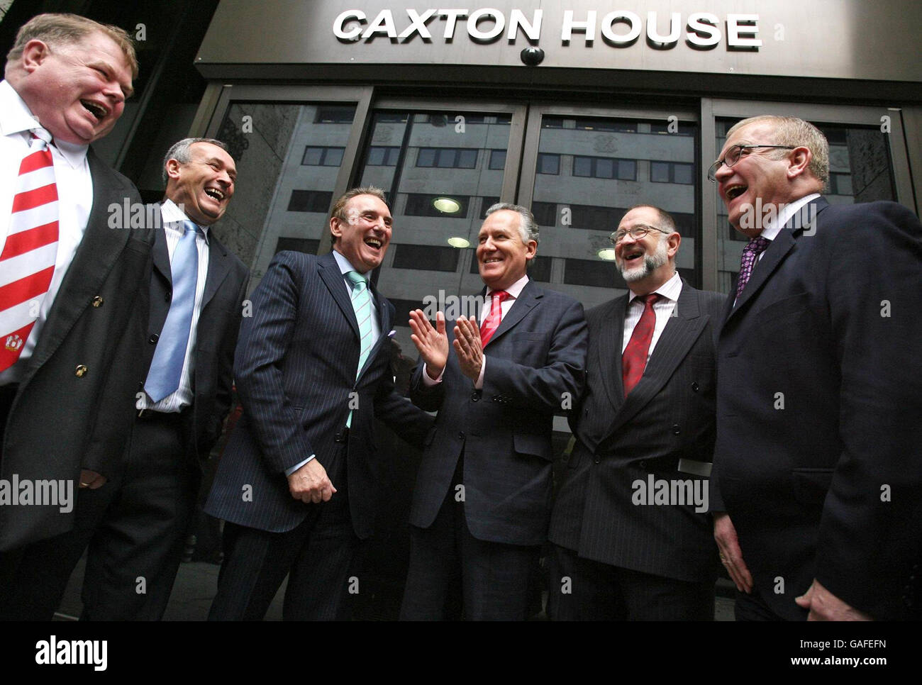 The Work and Pensions Secretary Peter Hain (centre) celebrates with ...