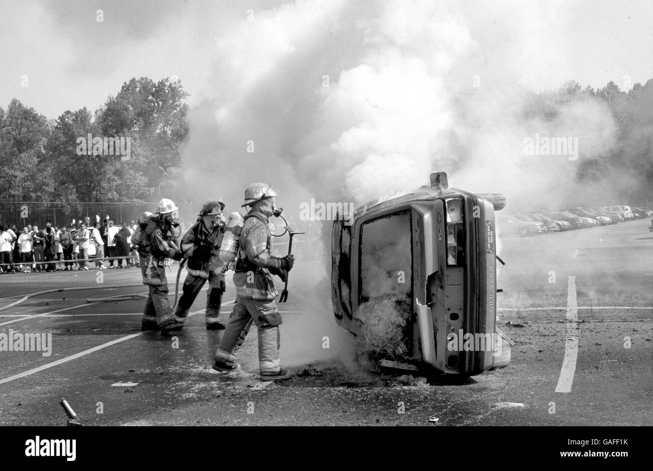 overturned car on fire Stock Photo - Alamy