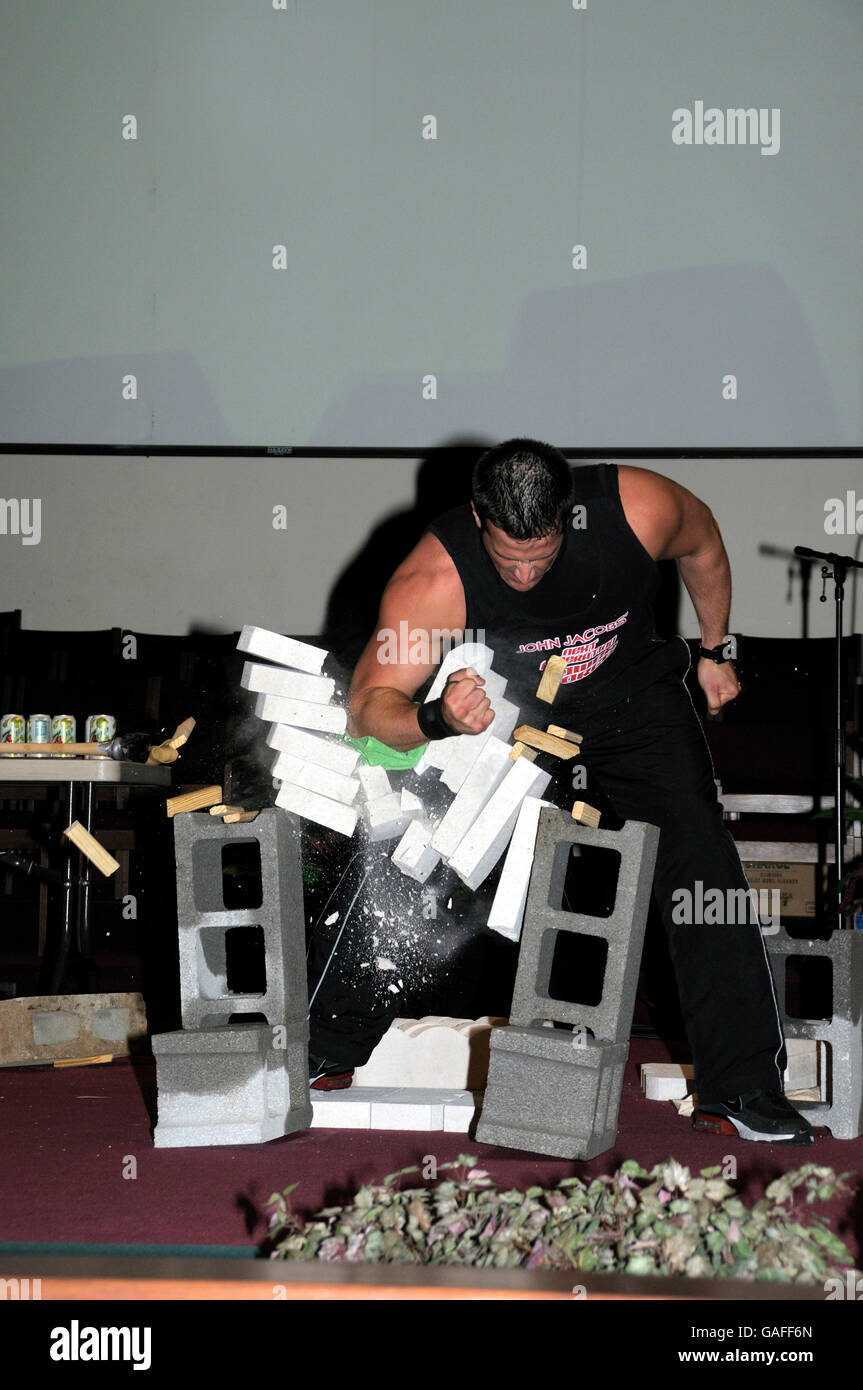 A member of John Jacob's Next Generation Strike Team breaks boards with ...