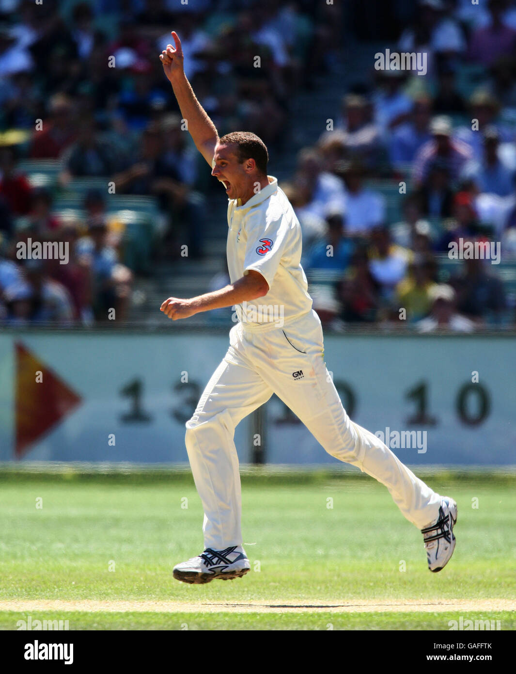 Australia's Stuart Clark celebrates claiming the wicket of India's M ...