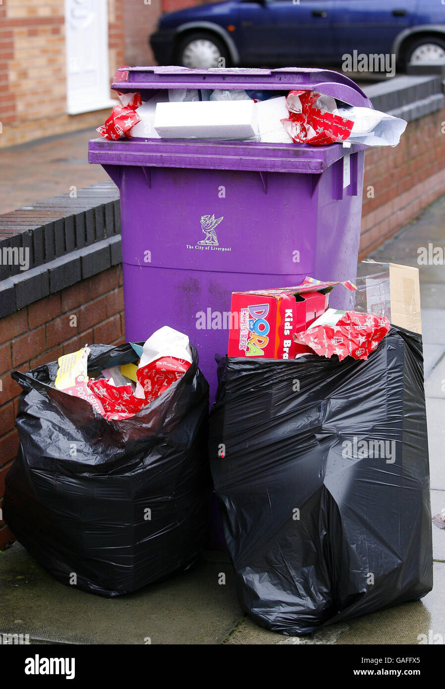 A rubbish bin in Liverpool overflows with wrapping paper and packaging ...