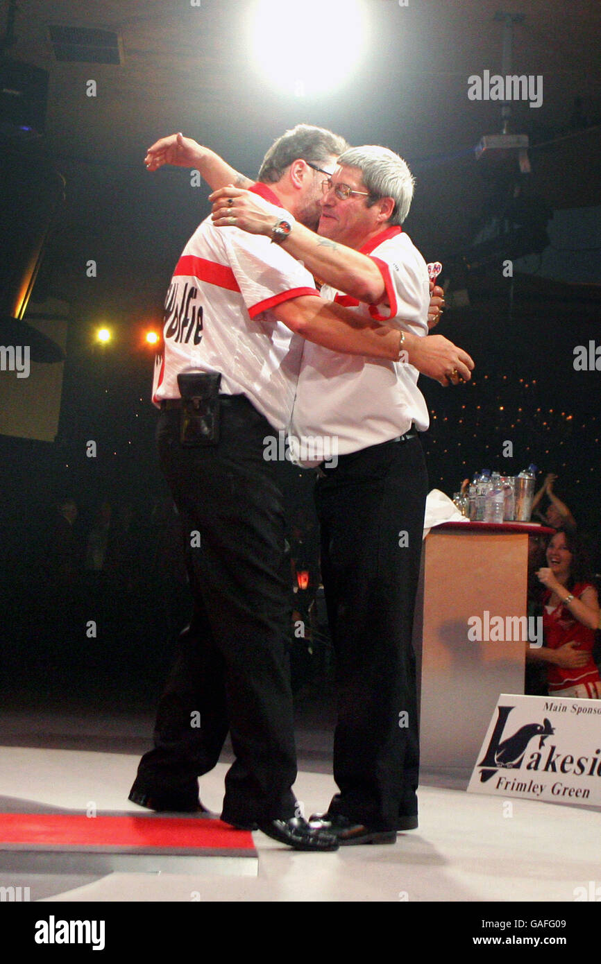 Martin Adams (l) hugs Phill Nixon (r) after beating him in the final of ...