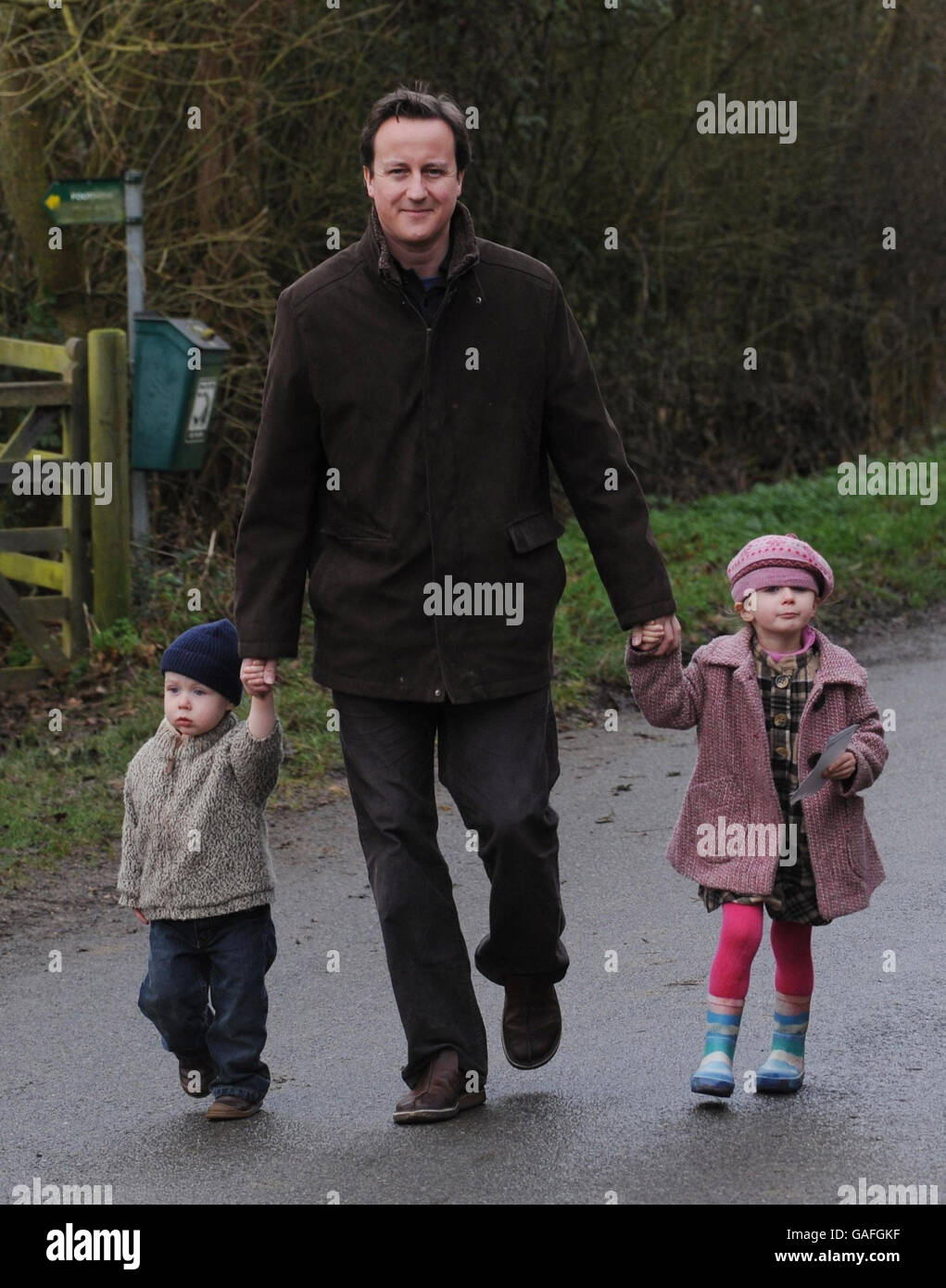 Conservative Party leader David Cameron walks through the village of ...
