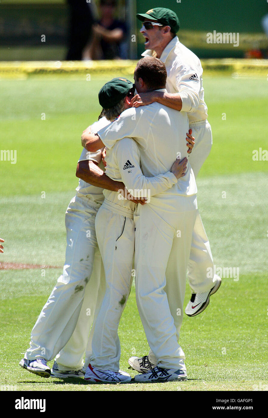 Australia's Michael Hussey congratulates Stuart Clark after claiming ...