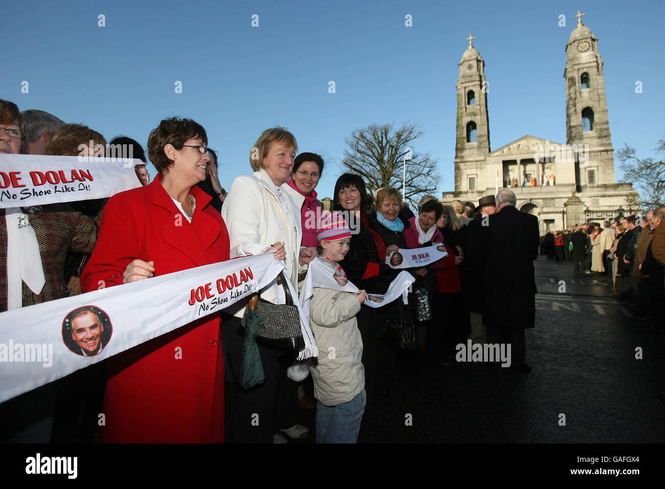 Thousands of fans gather for the funeral of singer Joe Dolan at the ...