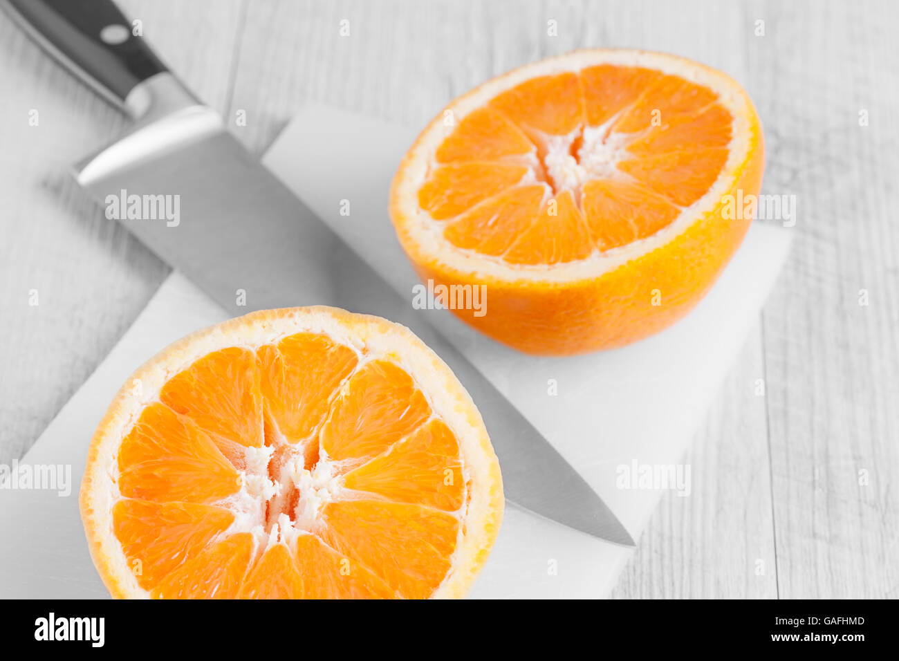 Orange Cut In Two Stock Photo - Alamy