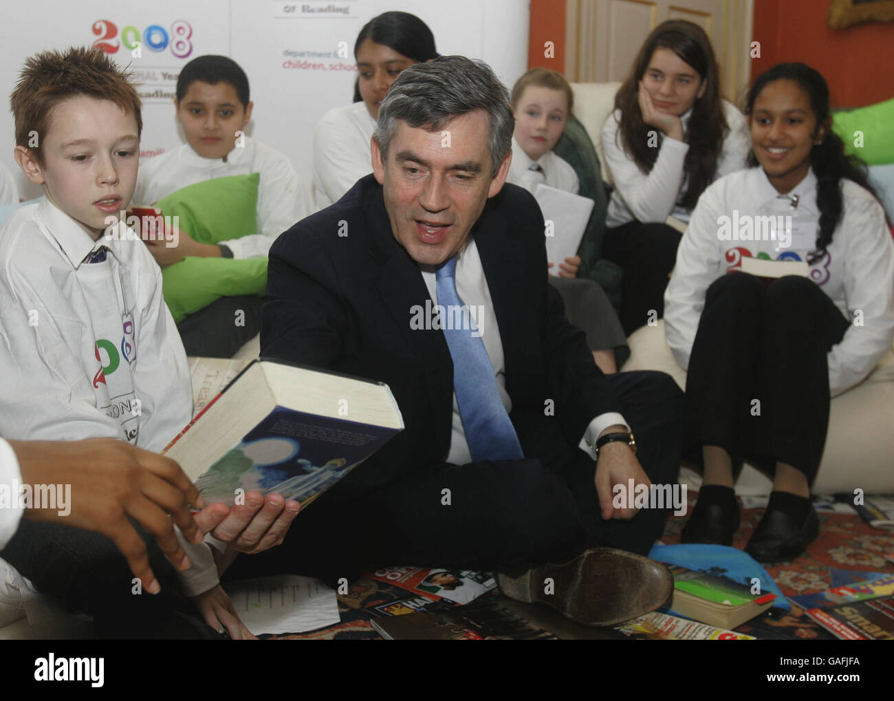 Britain's Prime Minister Gordon Brown sits with children from Oxford ...