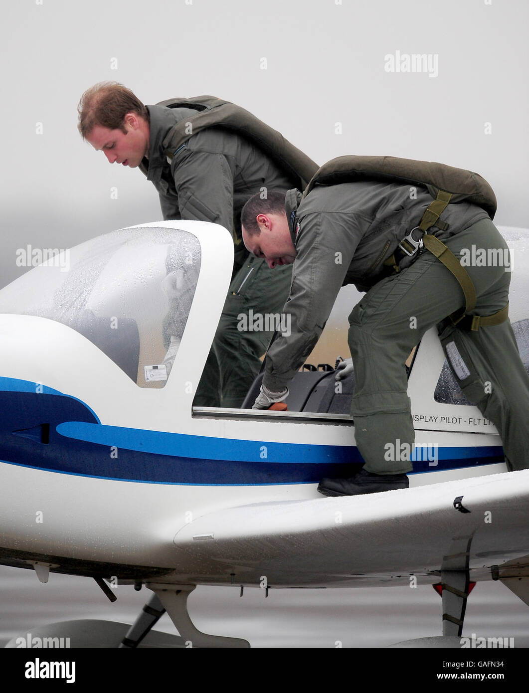 Prince William with Squadron Leader Roger Bousfield as he prepares to ...