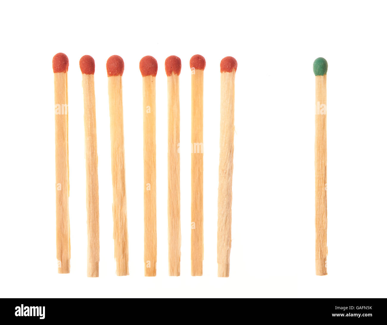 Set of seven red wooden matches and one green isolated on white ...