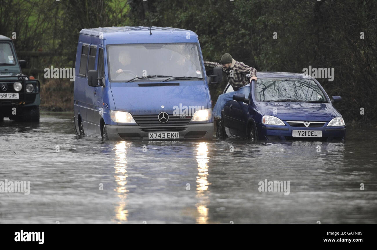 A Driver Is Rescued After His Car Became Trapped In Rising Floodwater