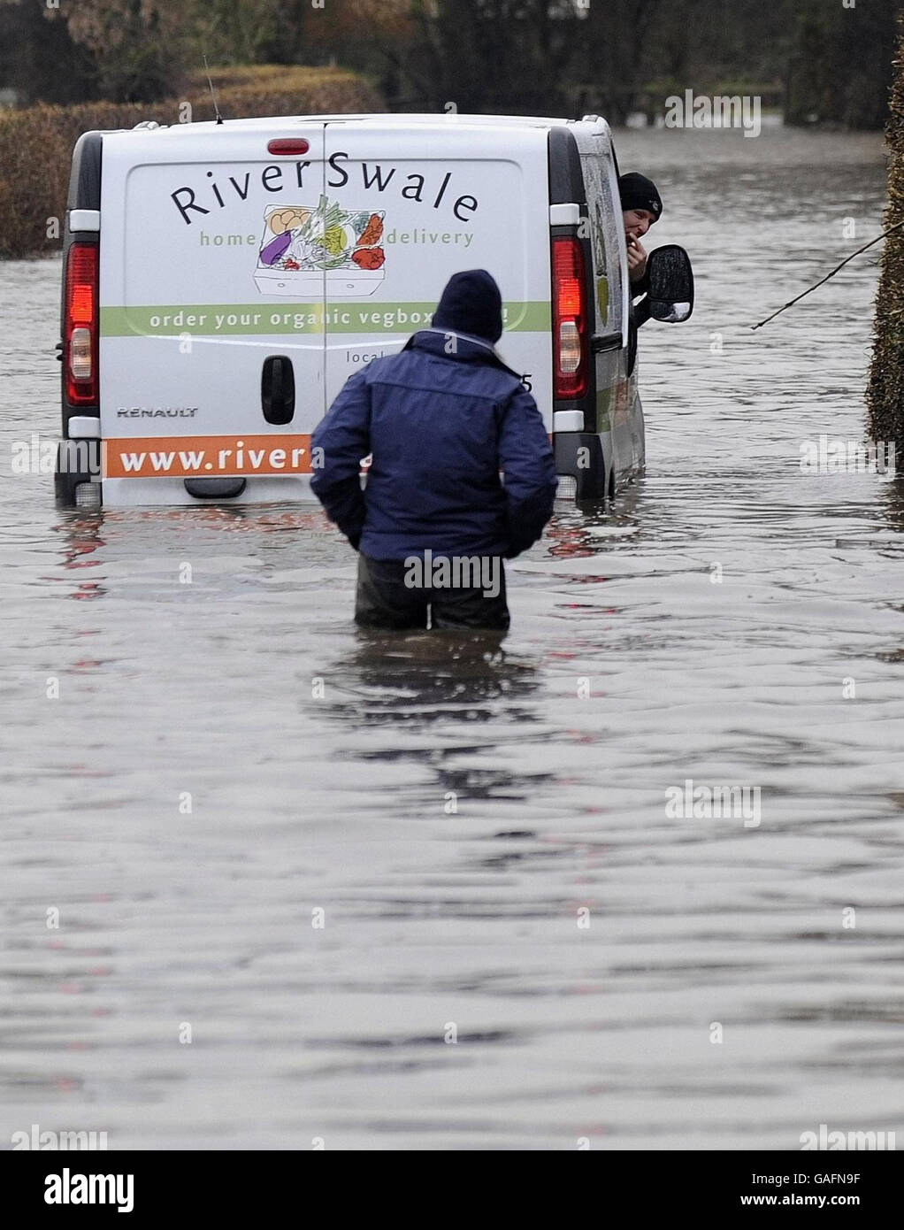 A Driver Is Rescued After His Car Became Trapped In Rising Floodwater