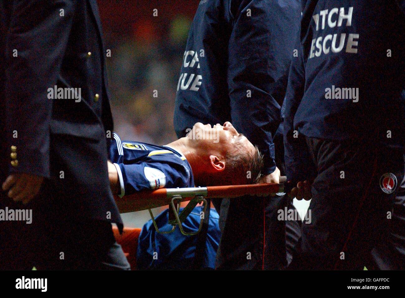 Is carried off on a stretcher hi-res stock photography and images - Alamy