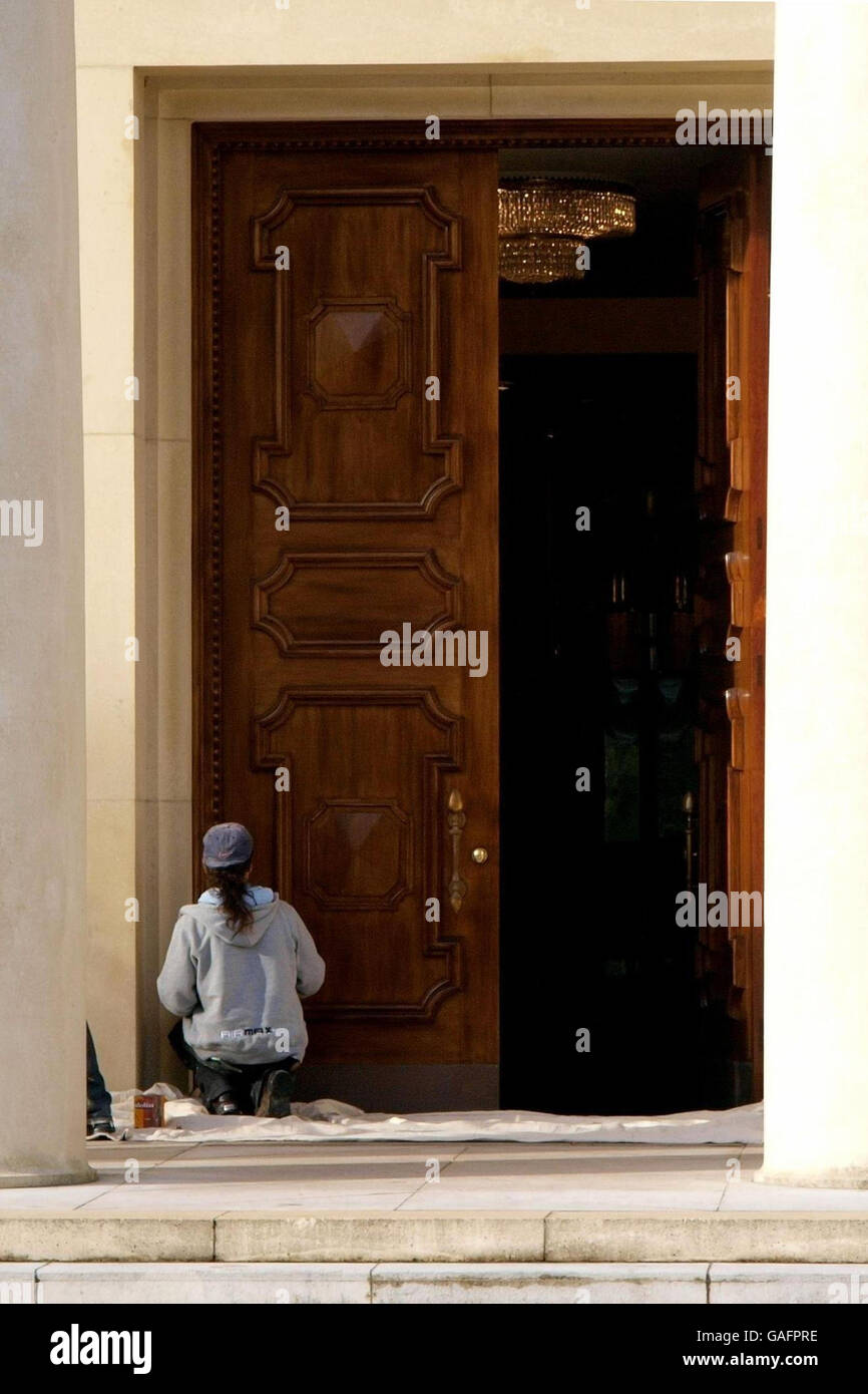 A painter at Toprak Mansion on Bishop's Avenue, Hampstead, which has ...