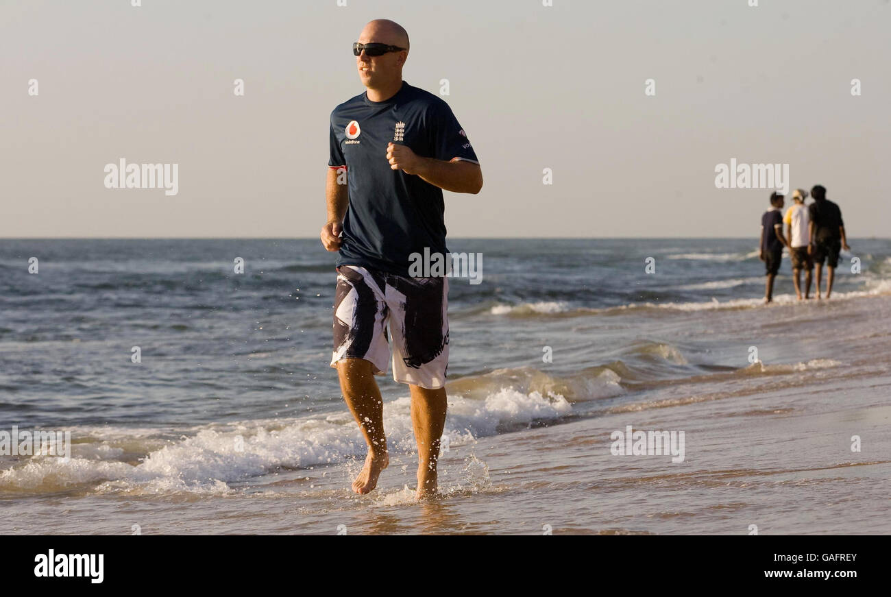 England cricketer Matthew Prior jogs along the beach during a visit to ...