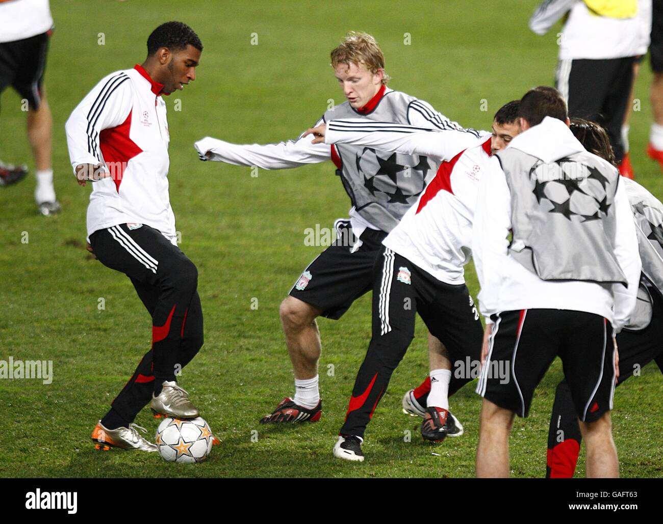 Liverpool's Ryan Babel and Dirk Kuyt compete for the ball during ...