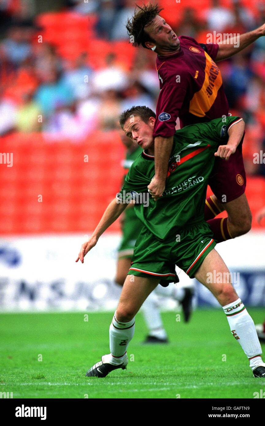(R-L) Motherwell's Dirk Lehmann rises above Dundee United's Jamie ...