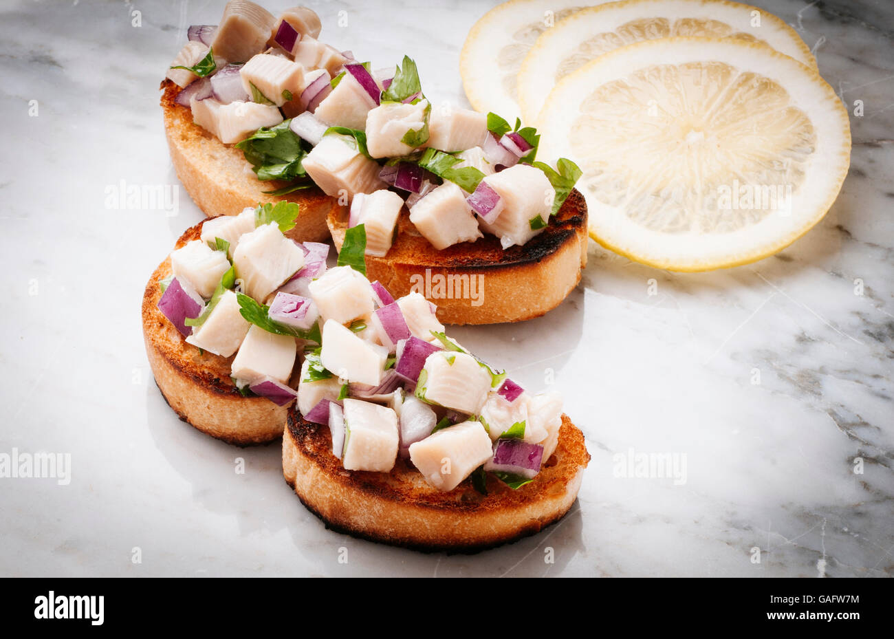 Delicious Toast with cuttlefish in Green Sauce Stock Photo - Alamy