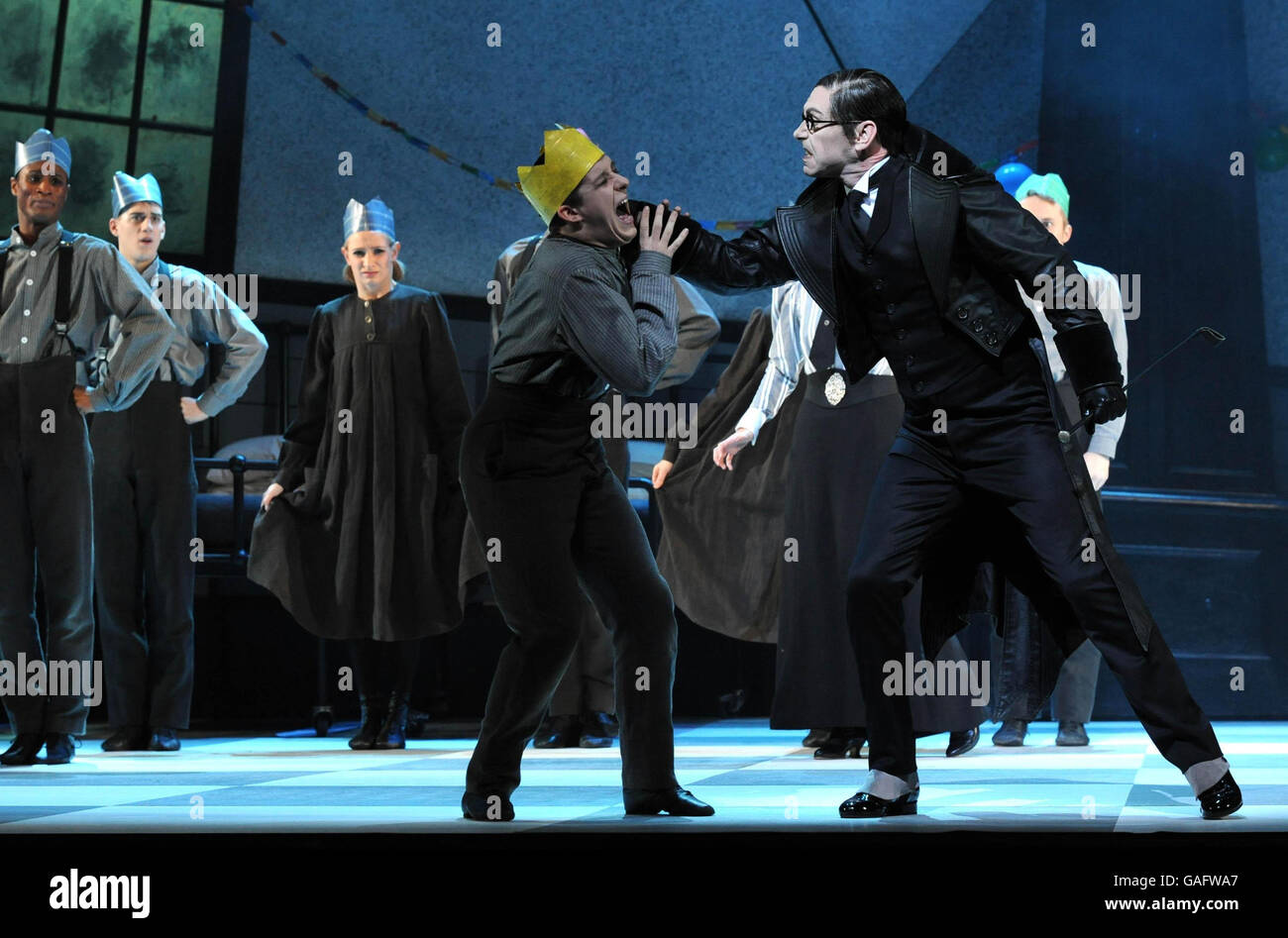 Dr Dross (right, played by Scott Ambler) grabs one of the orphan boys as they perform Matthew ...