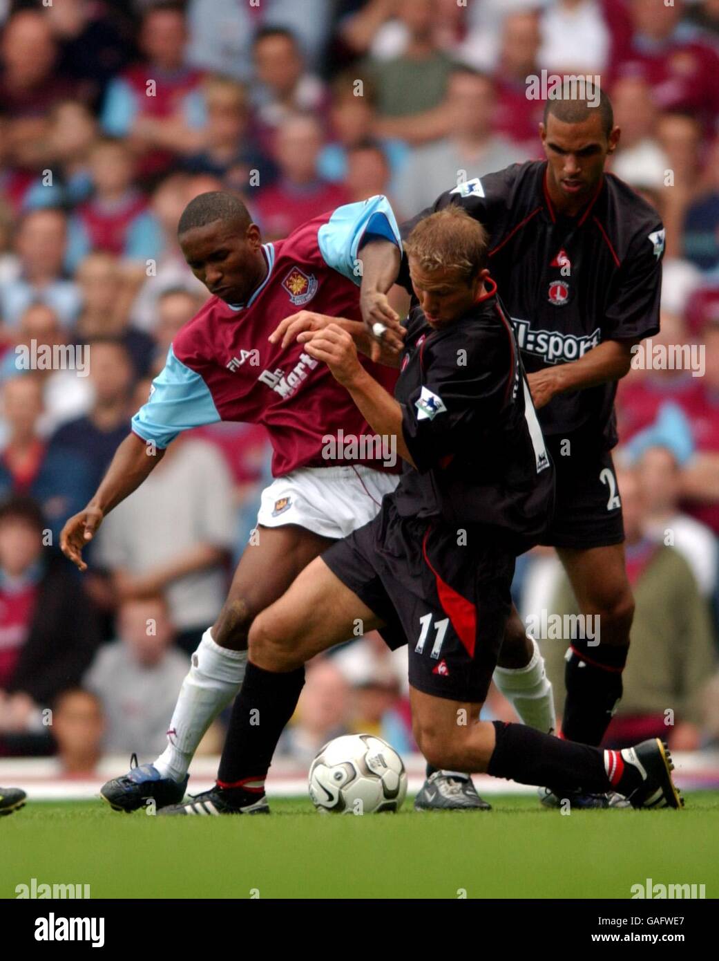 l-r West Ham United's Jermain Defoe battles for possession of the ball ...