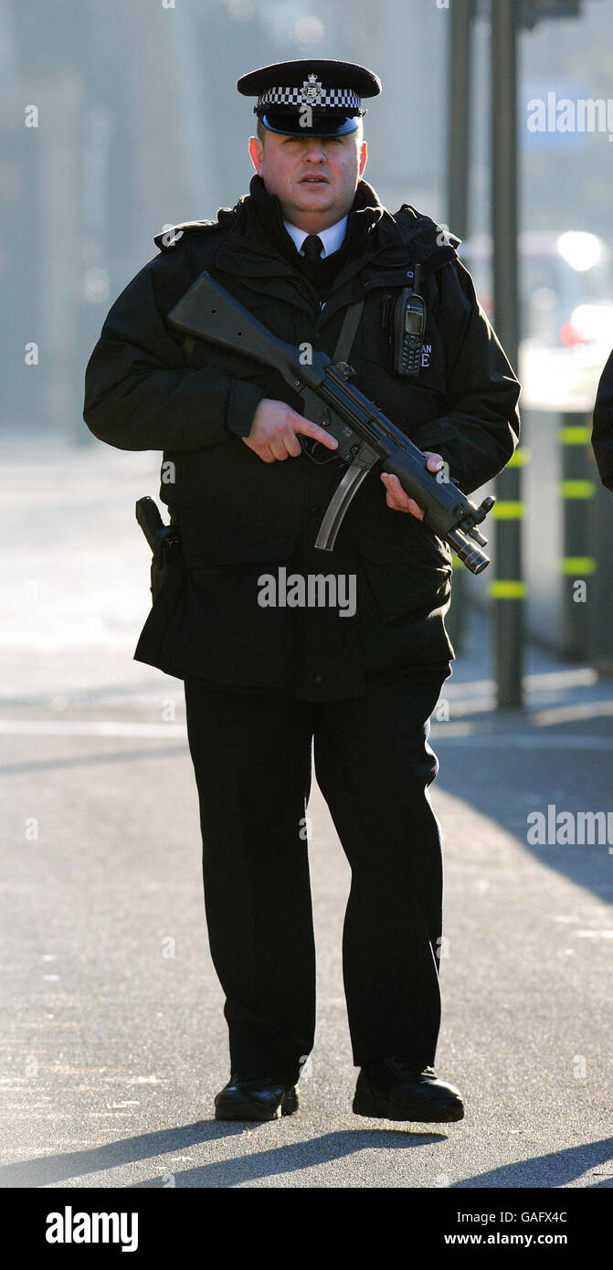 An armed Metropolitan Police officer on the beat in Westminster ...