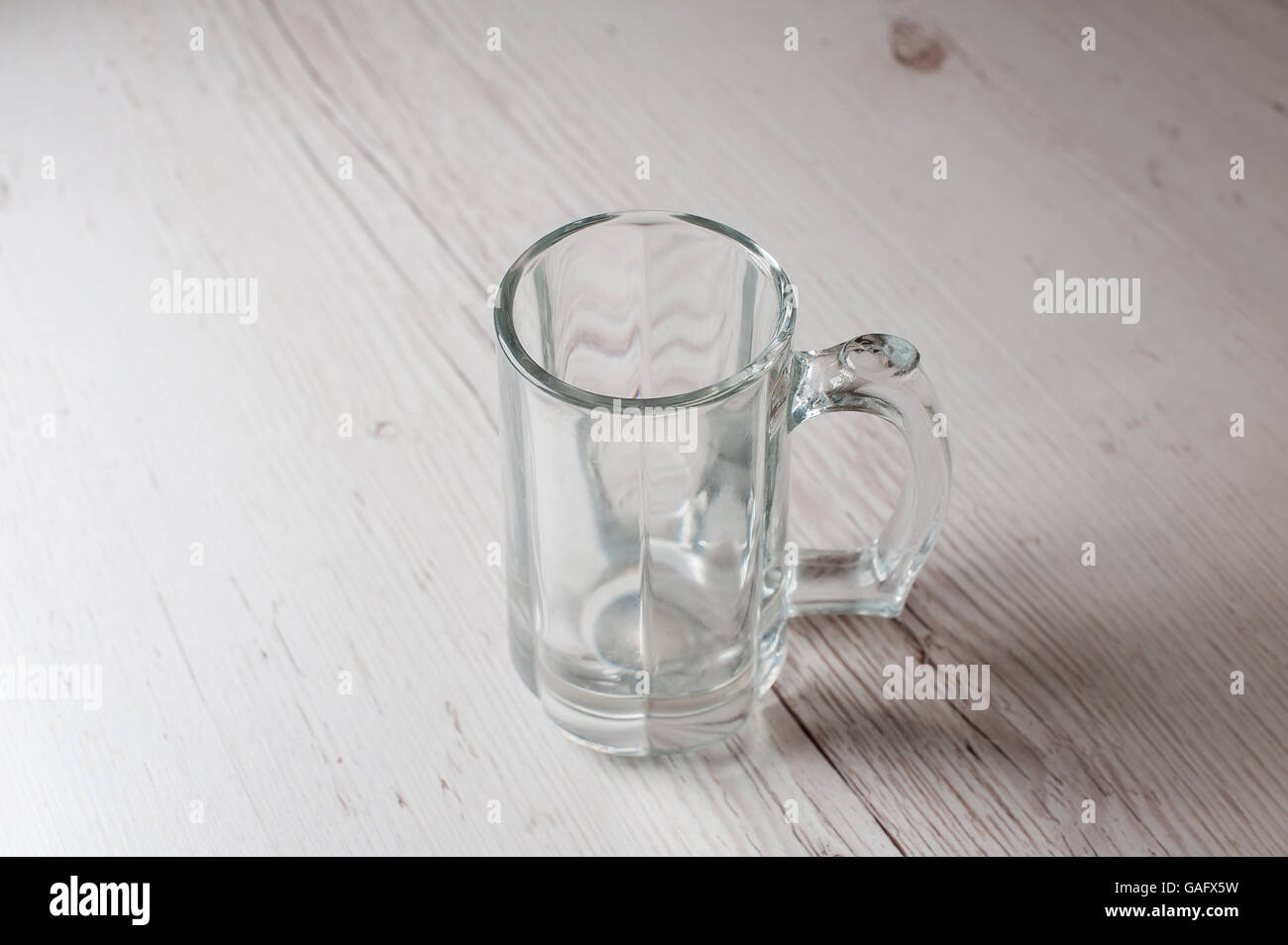 Empty Beer Mug on a light wooden background Stock Photo - Alamy