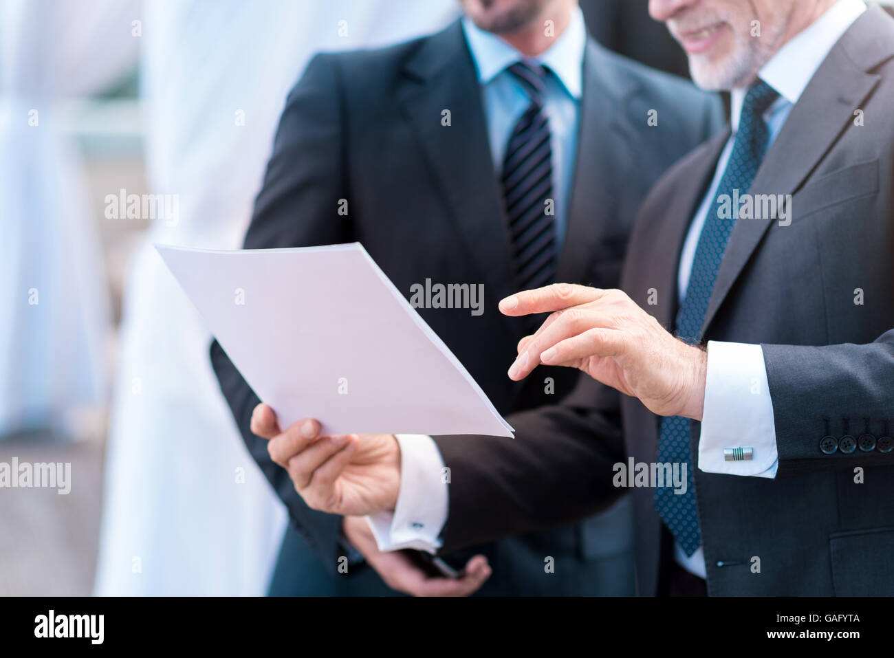 Professional colleagues working with papers Stock Photo - Alamy