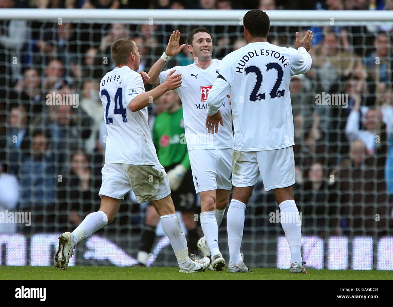 Tottenham Hotspur's Robbie Keane (centre) celebrates scoring the first ...