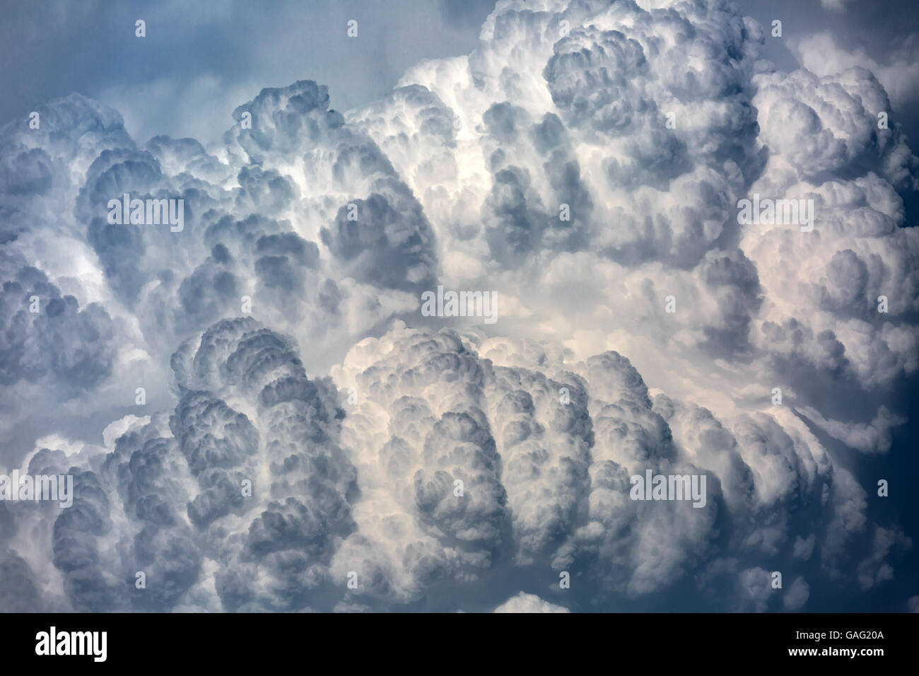 Cloudscape with very big cumulonimbus clouds shot with a long tele ...