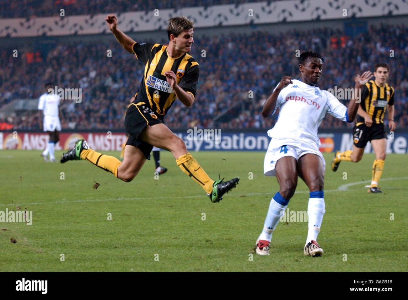 AEK Athens' Milen Petkov (l) shoots for goal under pressure from RC ...