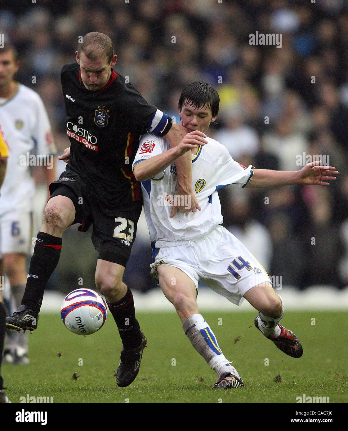 Leeds United's Jonathan Howson and Huddersfield Town's Andy Booth ...