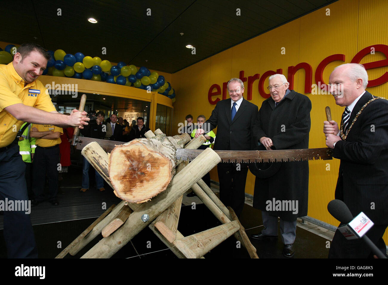 Belfast Lord Mayor Jim Rodgers (right) saws a log to officially open ...