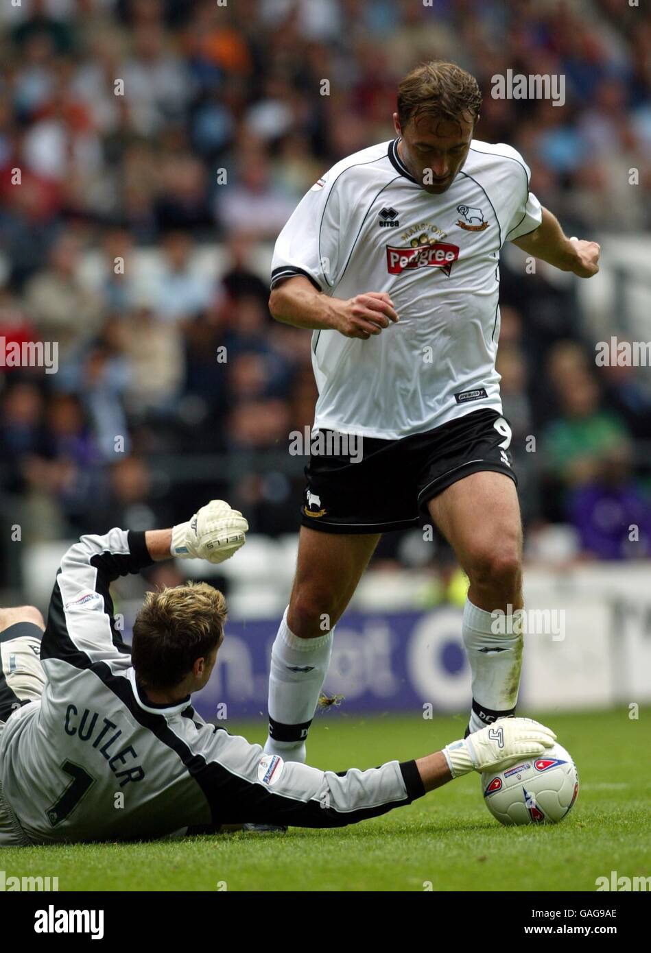 Stoke City's goalkeeper Neil Cutler saves the ball from Derby County's ...