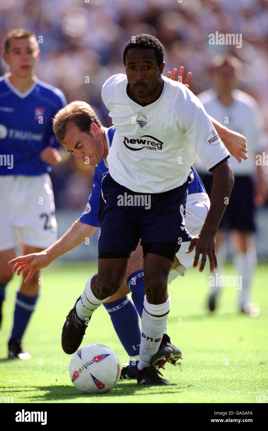 Preston North End's Ricardo Fuller(front) holds off the challenge of ...