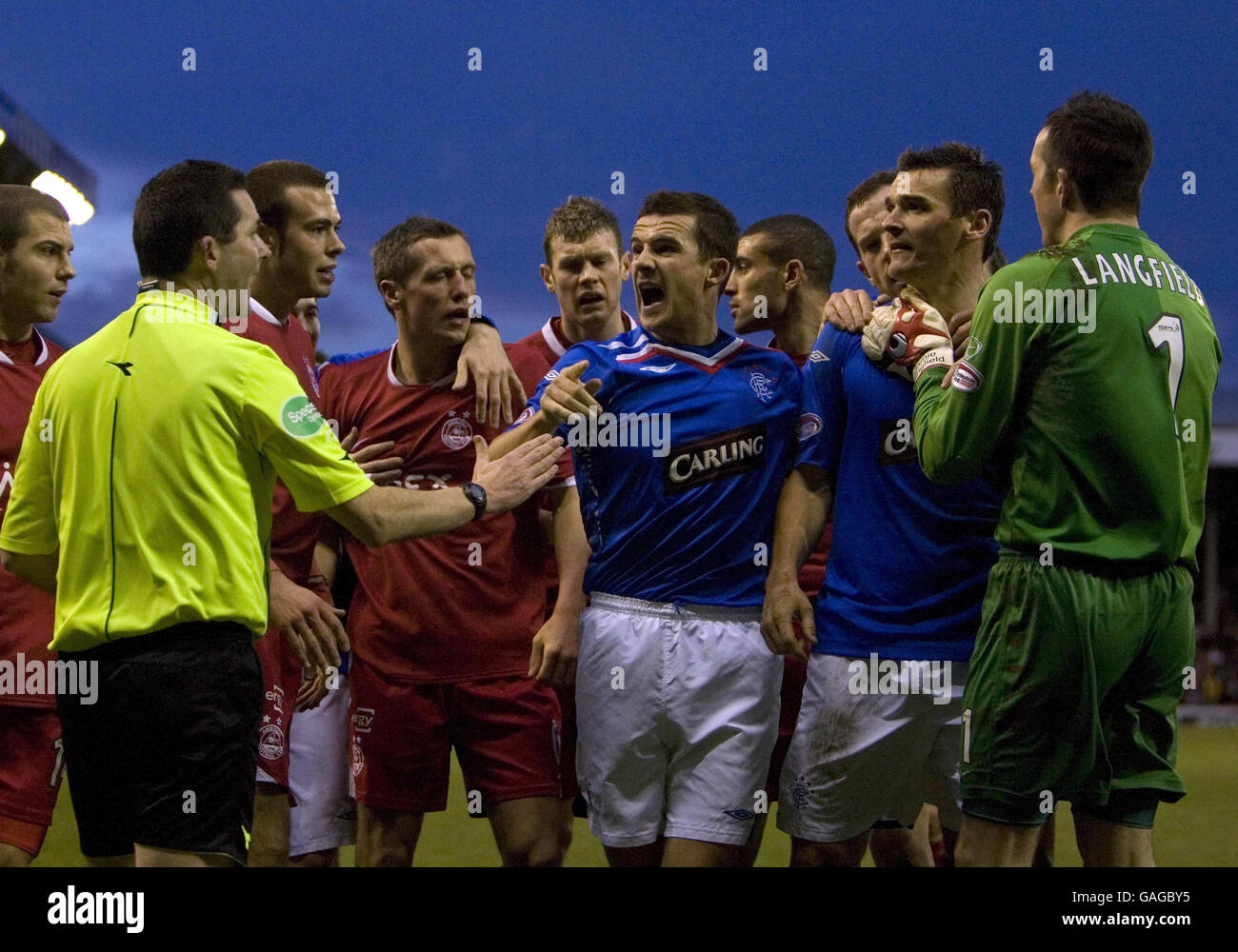 Rangers' Lee McCulloch (right) is held back after a confrontation with ...