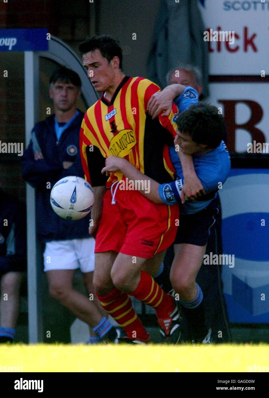 Partick thistles ricky waddell held back by dundees barry smith hi-res ...