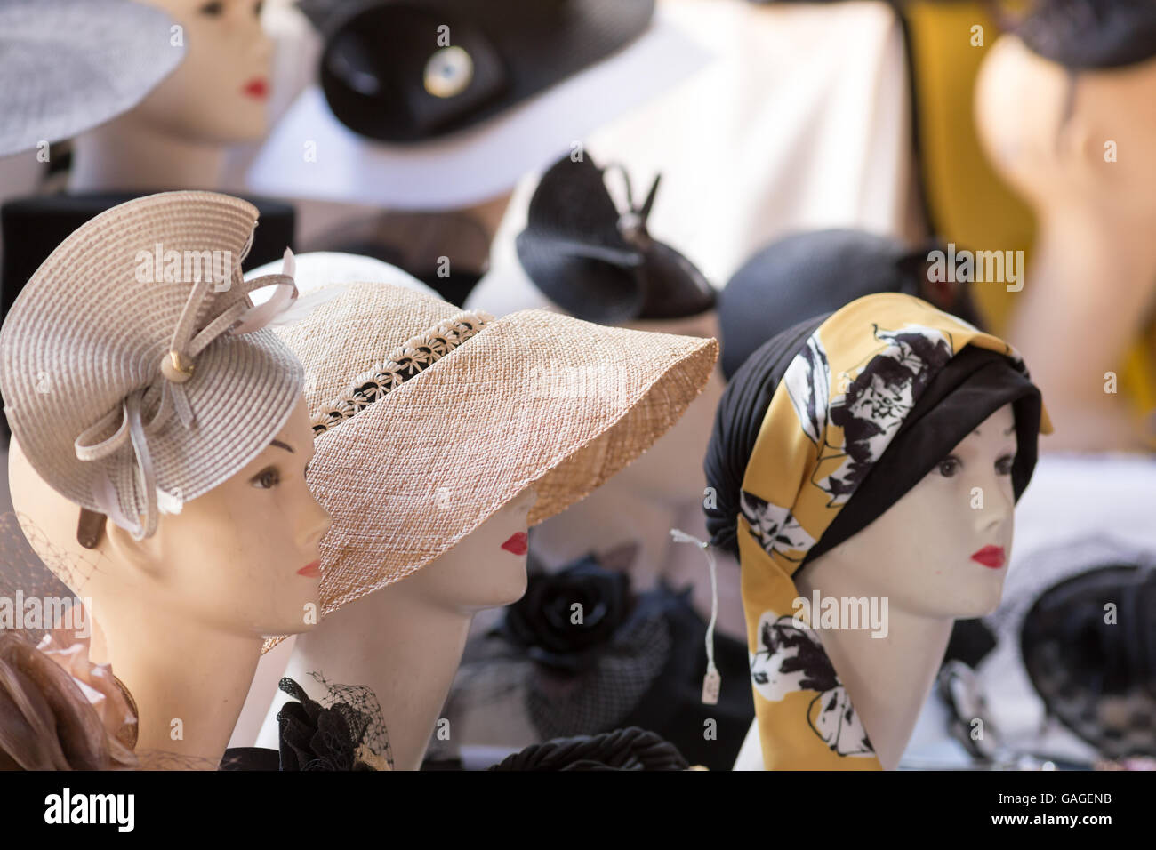 Female hats on sale in a street market, sunny day Stock Photo - Alamy