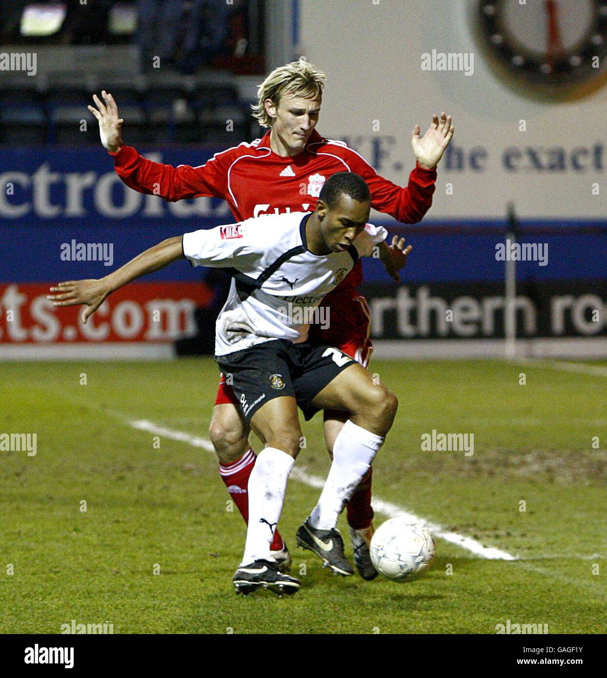 Luton Town's Calvin Andrew and Liverpool's Sami Hyypia battle for the ...