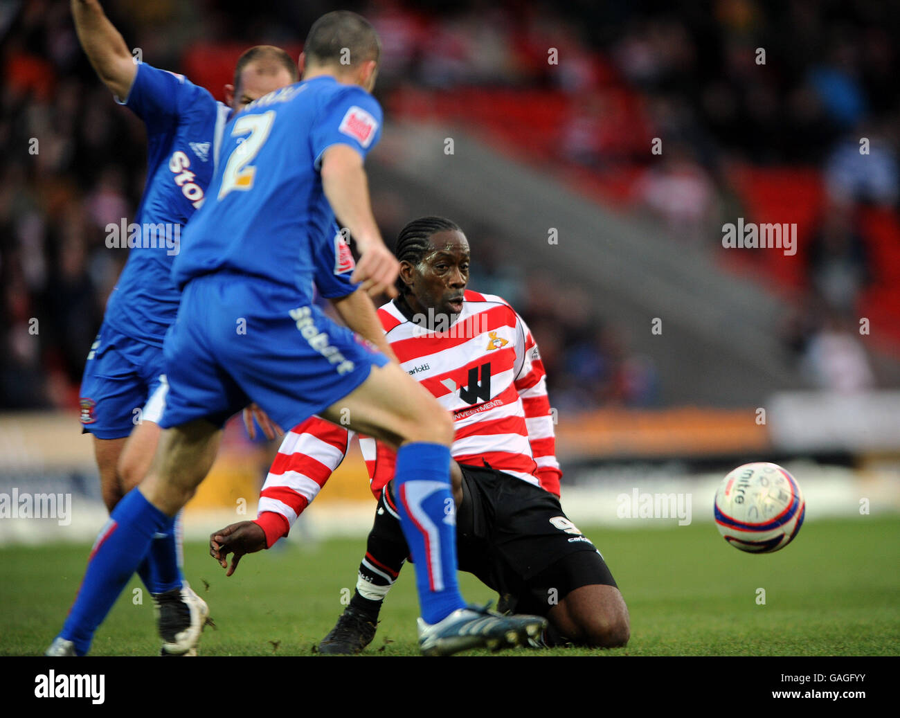 Doncaster Rovers' Mark McCammon gets a shot in despite the clise ...
