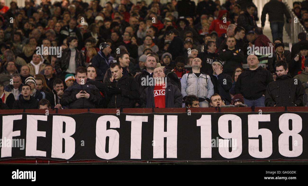 Manchester United fans behind a banner commemorating the munich ...